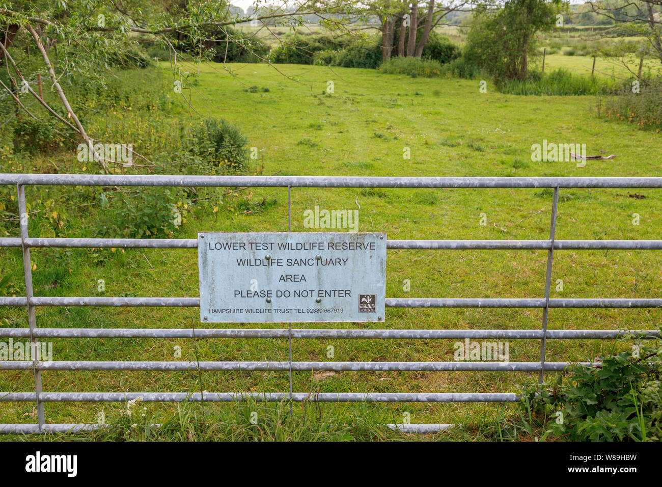 Name and no entry sign on a gate to a field in countryside at the Lower ...