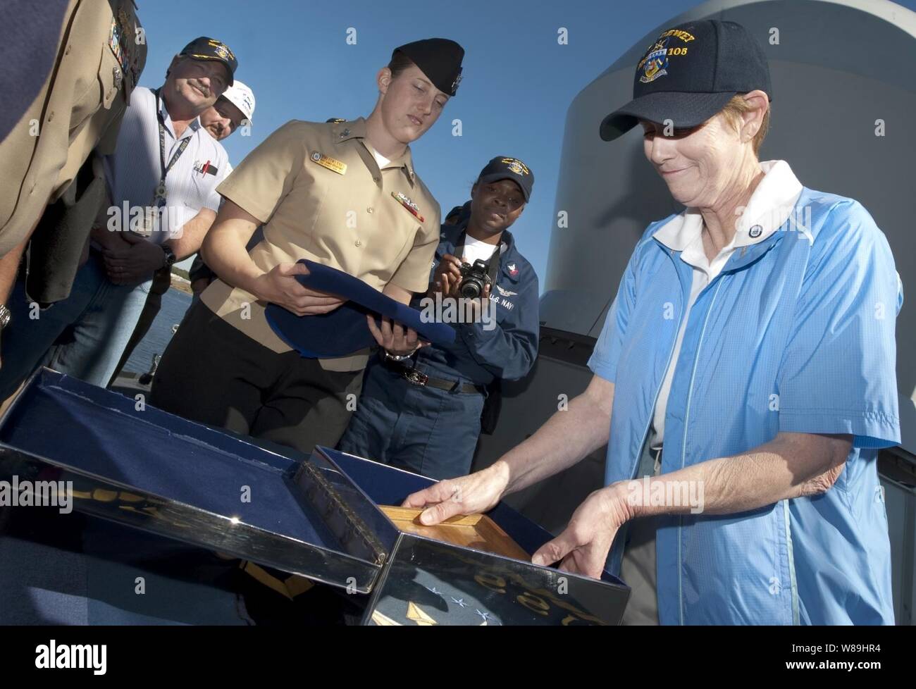 Deborah Mullen lays pieces of good luck into a steel box, 2009 Stock ...