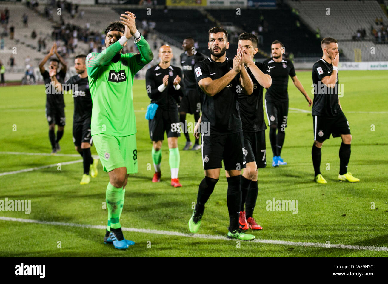 The players of Partizan celebrate the victory at the end of the game ...