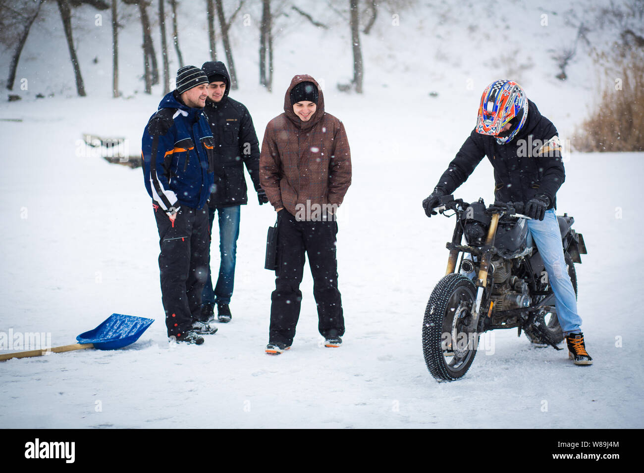 A guy rides a motorcycle on a frozen lake Stock Photo - Alamy