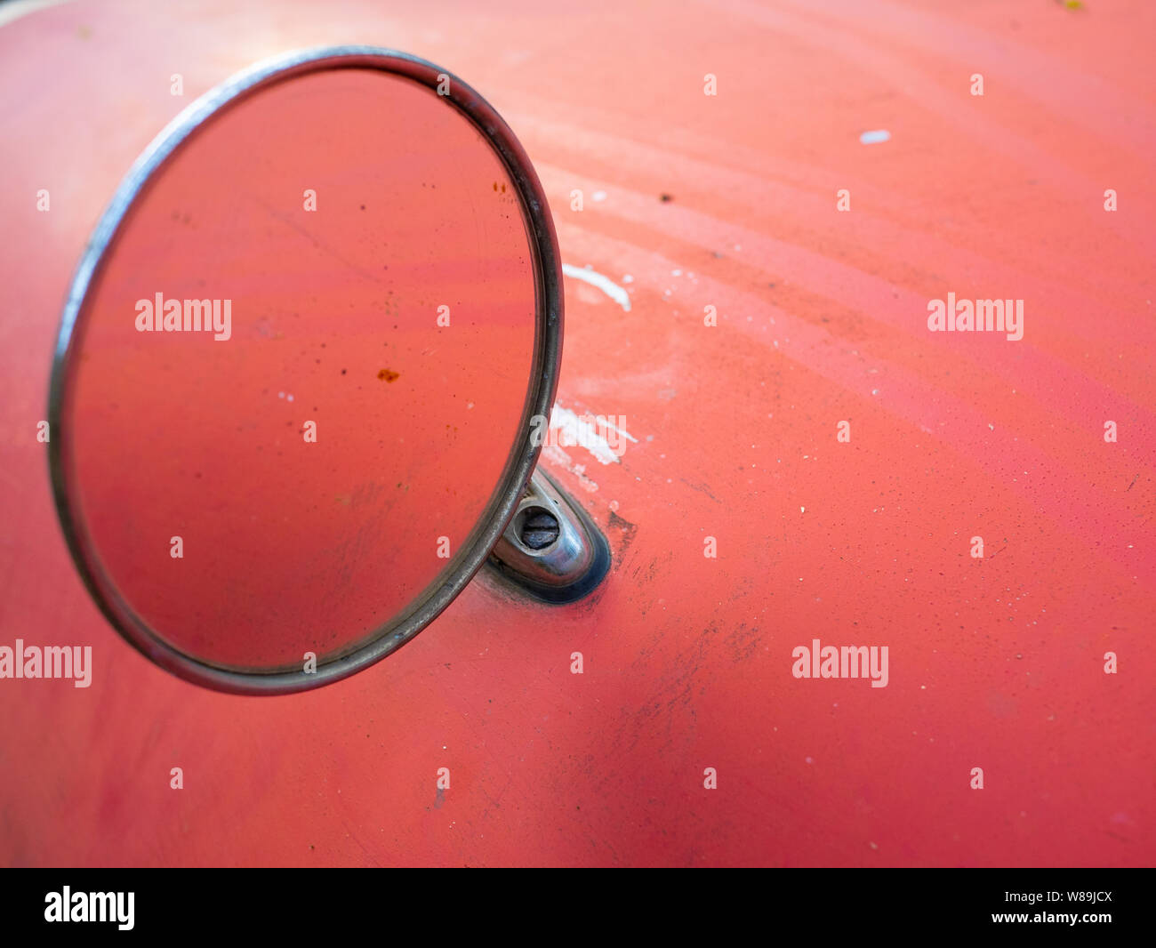 Rear view mirror of an old red car Stock Photo - Alamy