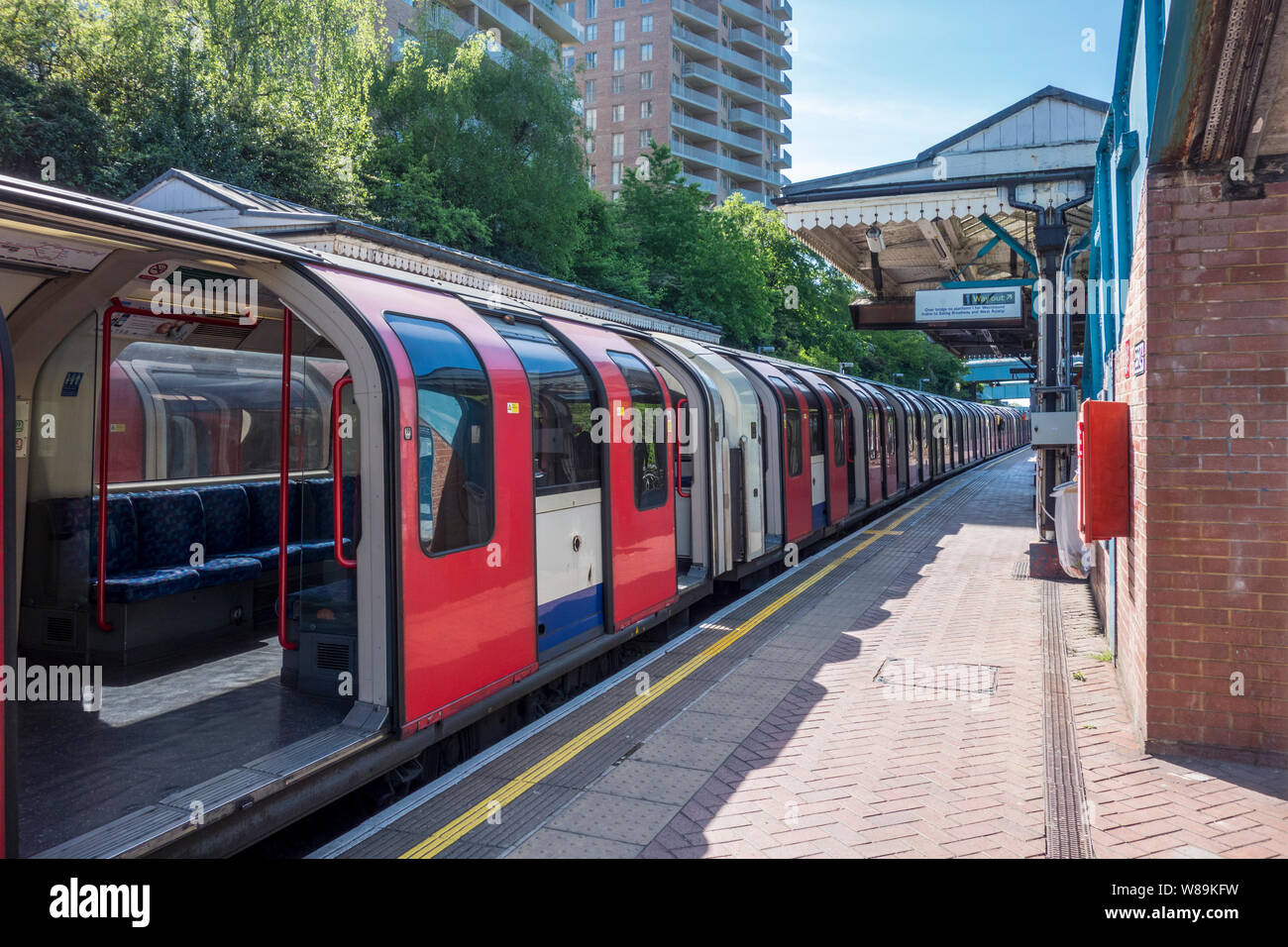 Central Line train at North Acton Underground Station platform, London ...