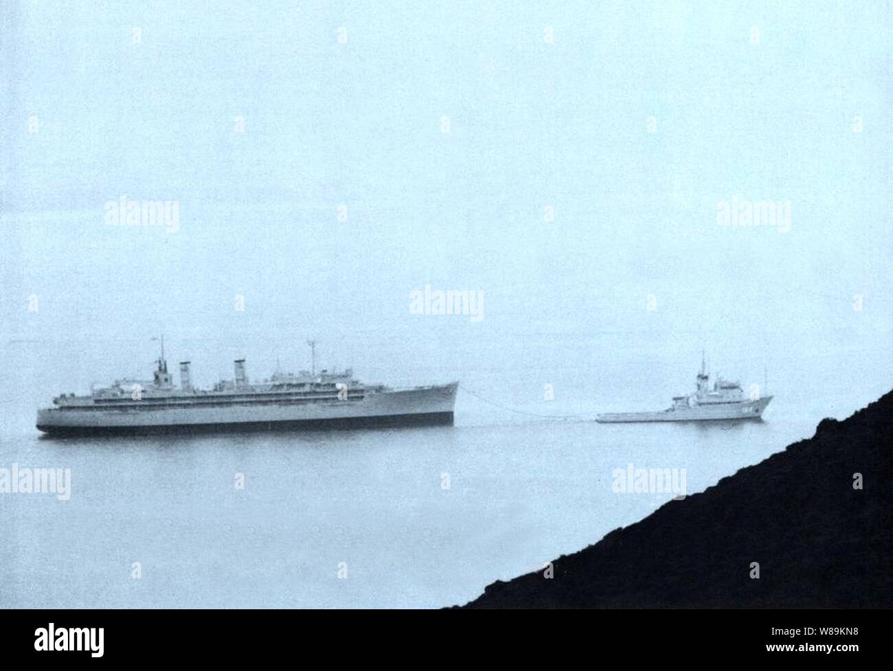 Decommissioned destroyer tender USS Dixie (AD-14) under tow, in 1982 ...