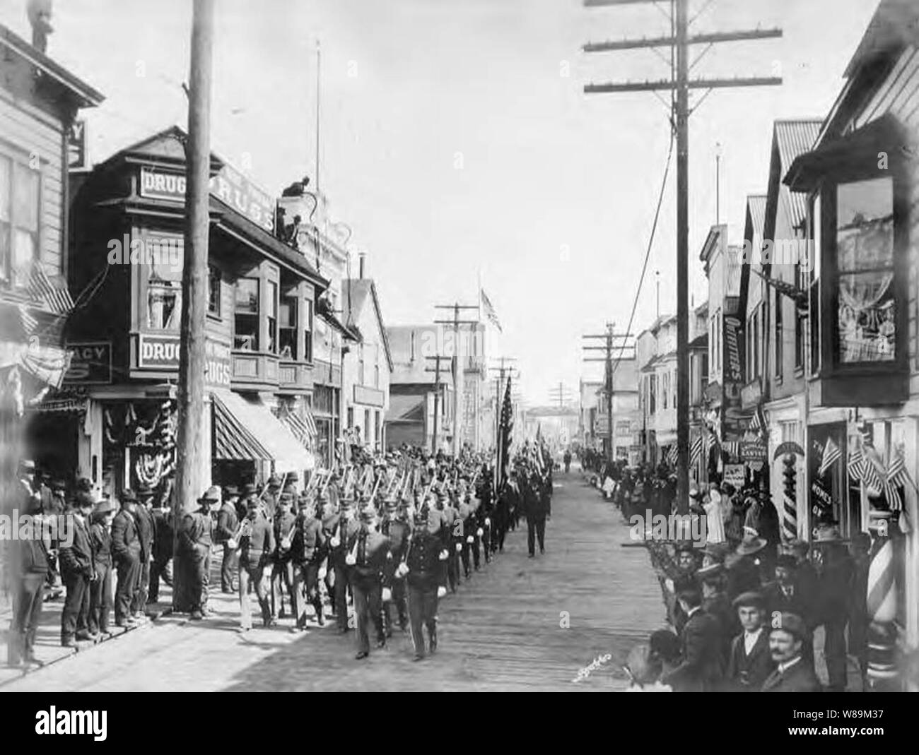Decoration Day parade of soldiers on board-planked street (probably ...