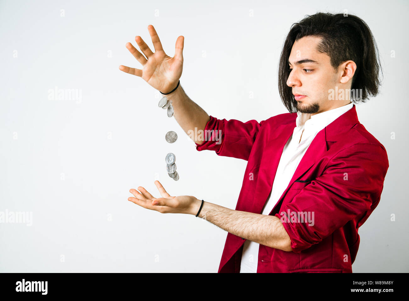 Young man manages some coins to make ends meet with his poor salary ...
