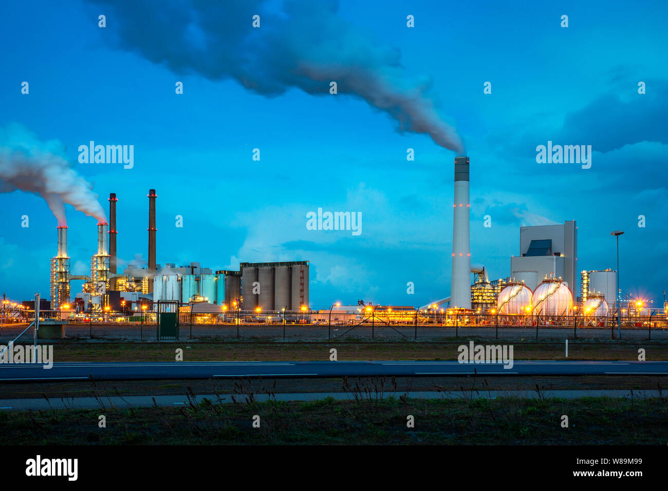 Oil refinery industry at night in Rotterdam, Netherlands. Pollution ...