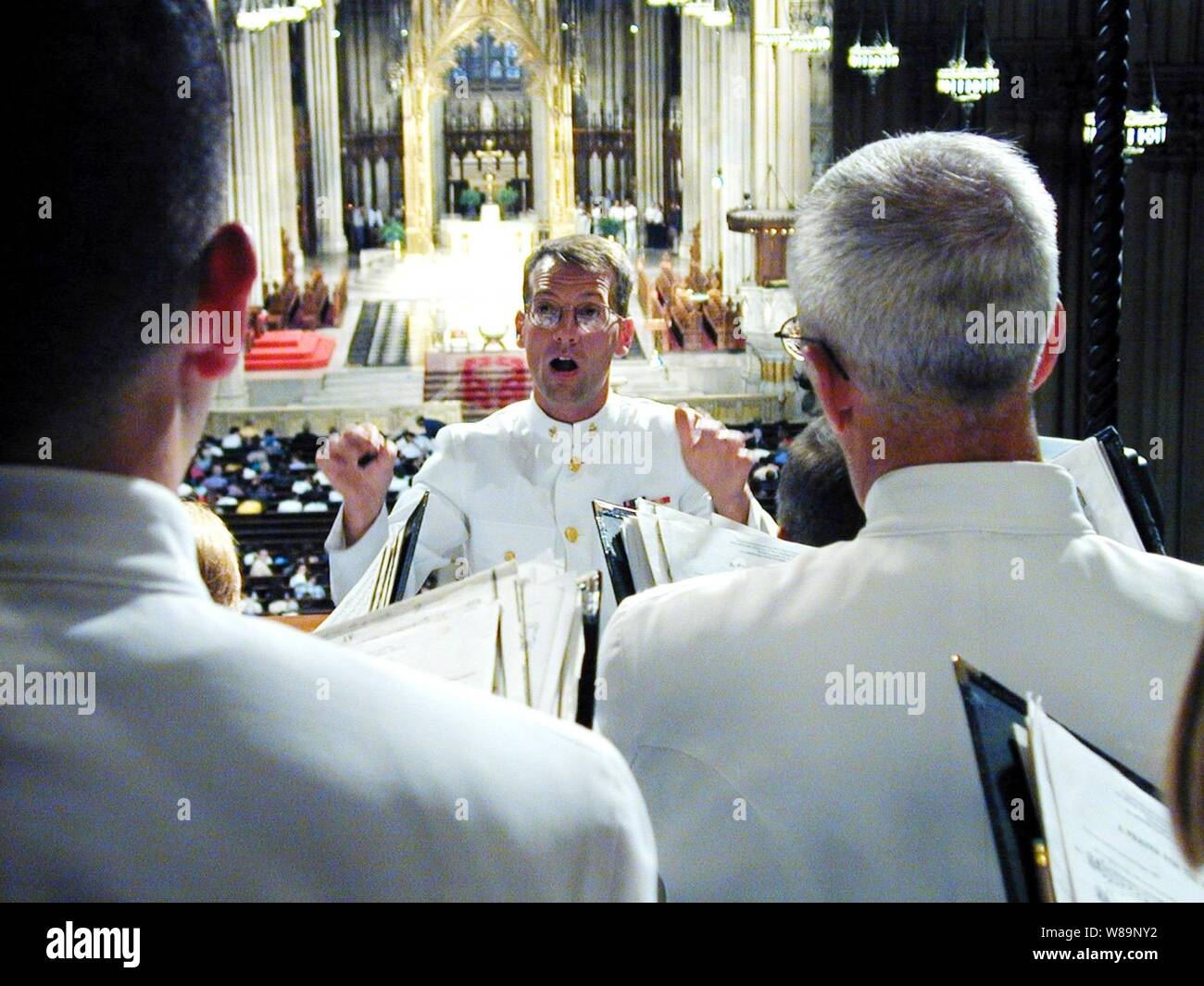 Chief Musician Keith D. Hinton directs the U.S. Navy Sea Chanters ...