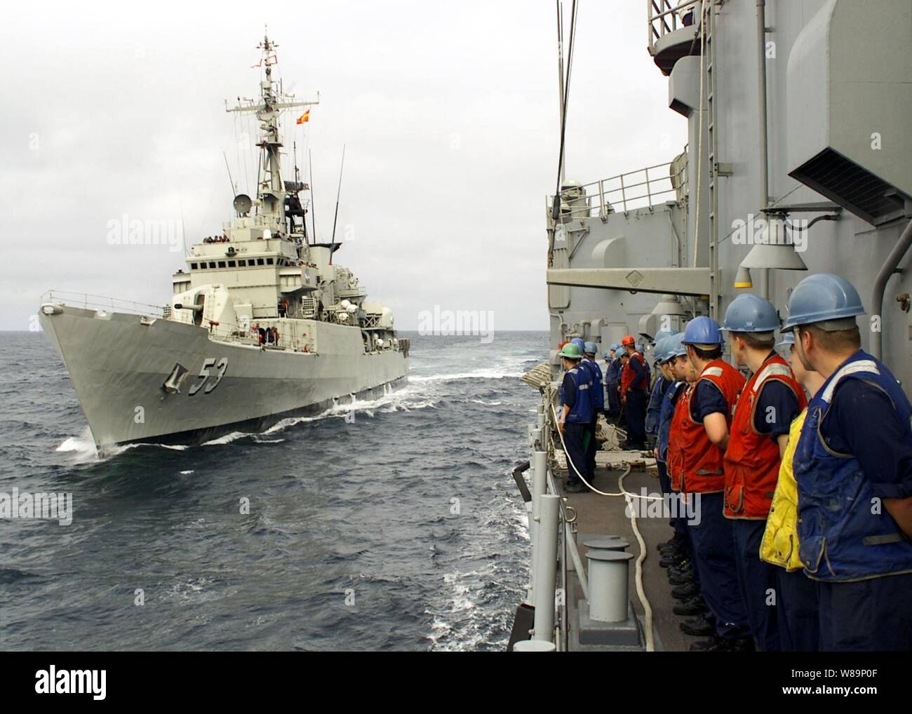 The crew of the USS Rodney M. Davis (FFG 60) stands by as the Peruvian ...