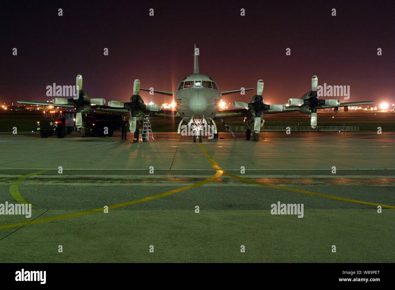 A U.S. Navy P-3C Orion aircraft sits on the flight line at Kadena Air ...