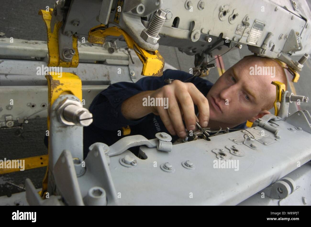 Navy Petty Officer 3rd Class Gary McIntosh conducts an inspection of a ...