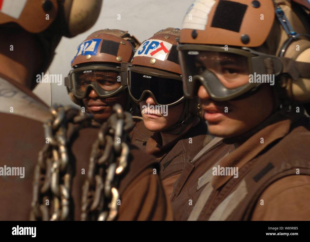 Navy plane captains stand by for the next launch cycle of flight ...