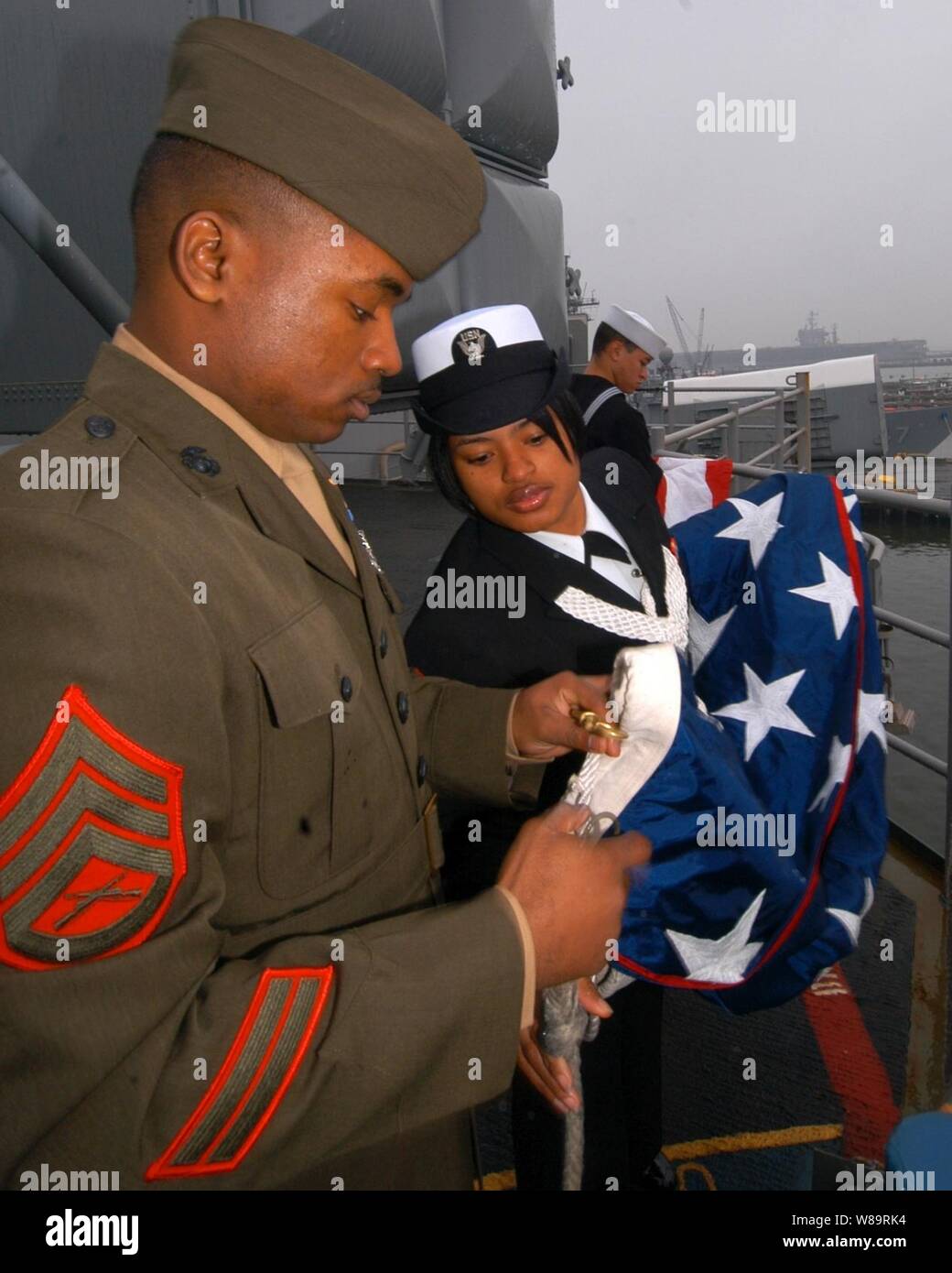 U.S. Marine Staff Sgt. Aaron J. Arrington, U.S. Navy Seaman Camilla Lee ...