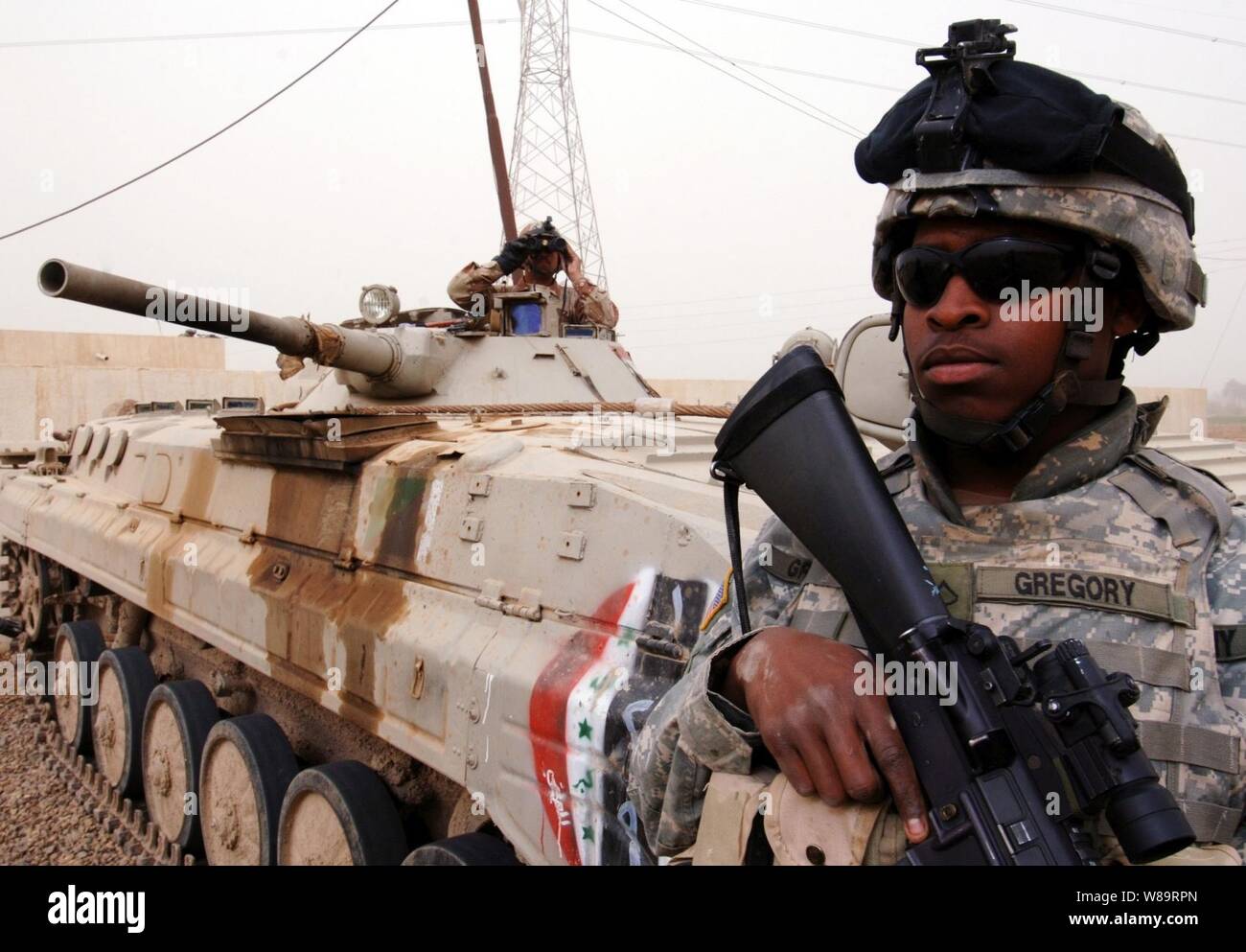 U.S. Army Pfc. Frederick Gregory maintains perimeter security as an ...