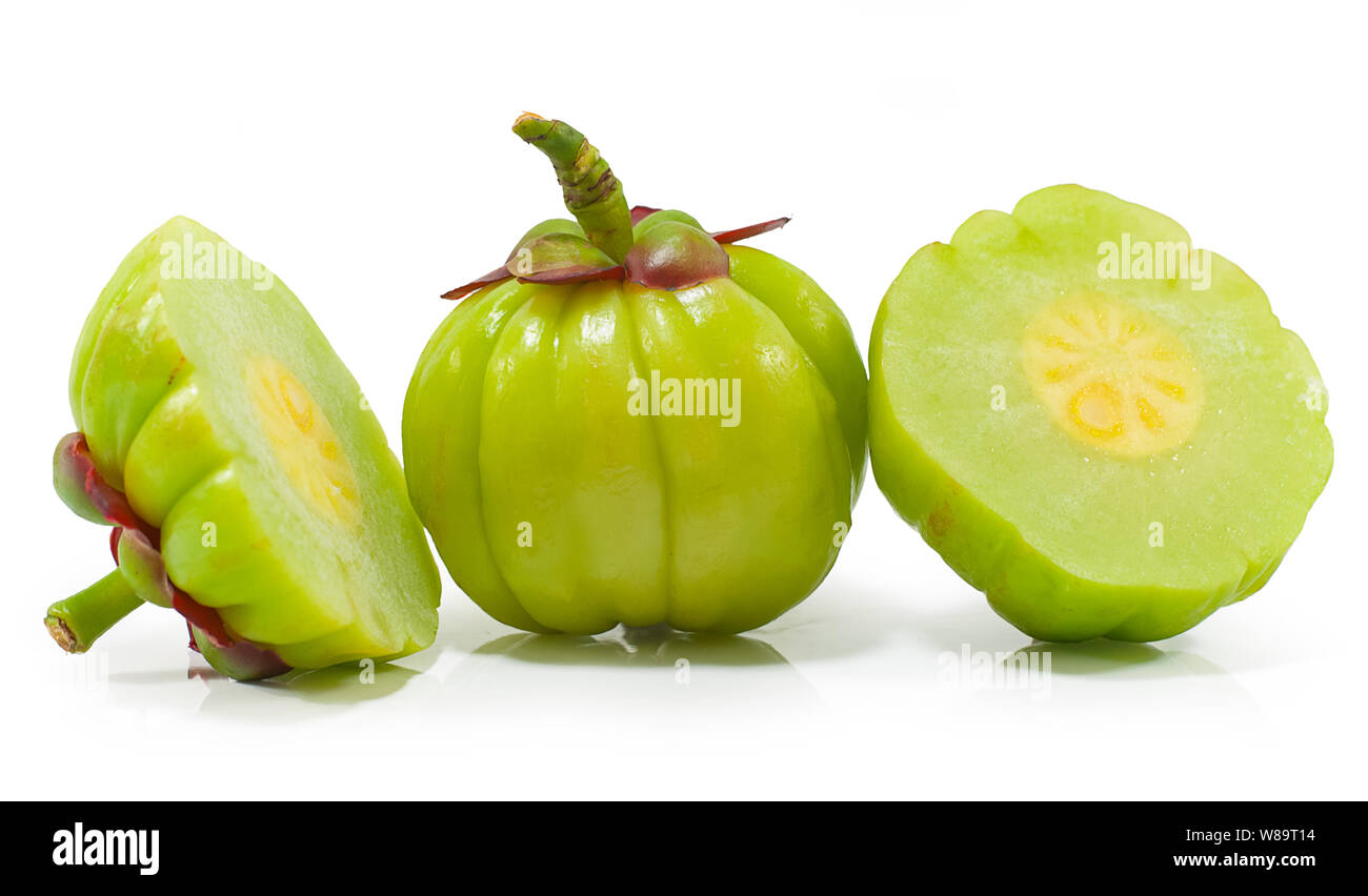 Garcinia atroviridis fruit isolated on white background Stock Photo - Alamy