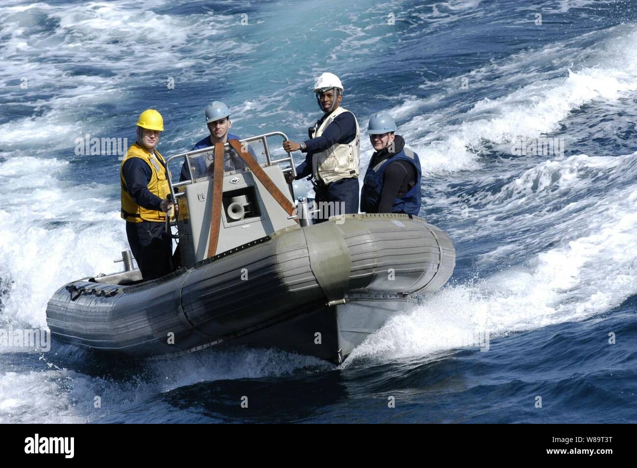 Sailors from the aircraft carrier USS Kitty Hawk (CV 63) head back to ...