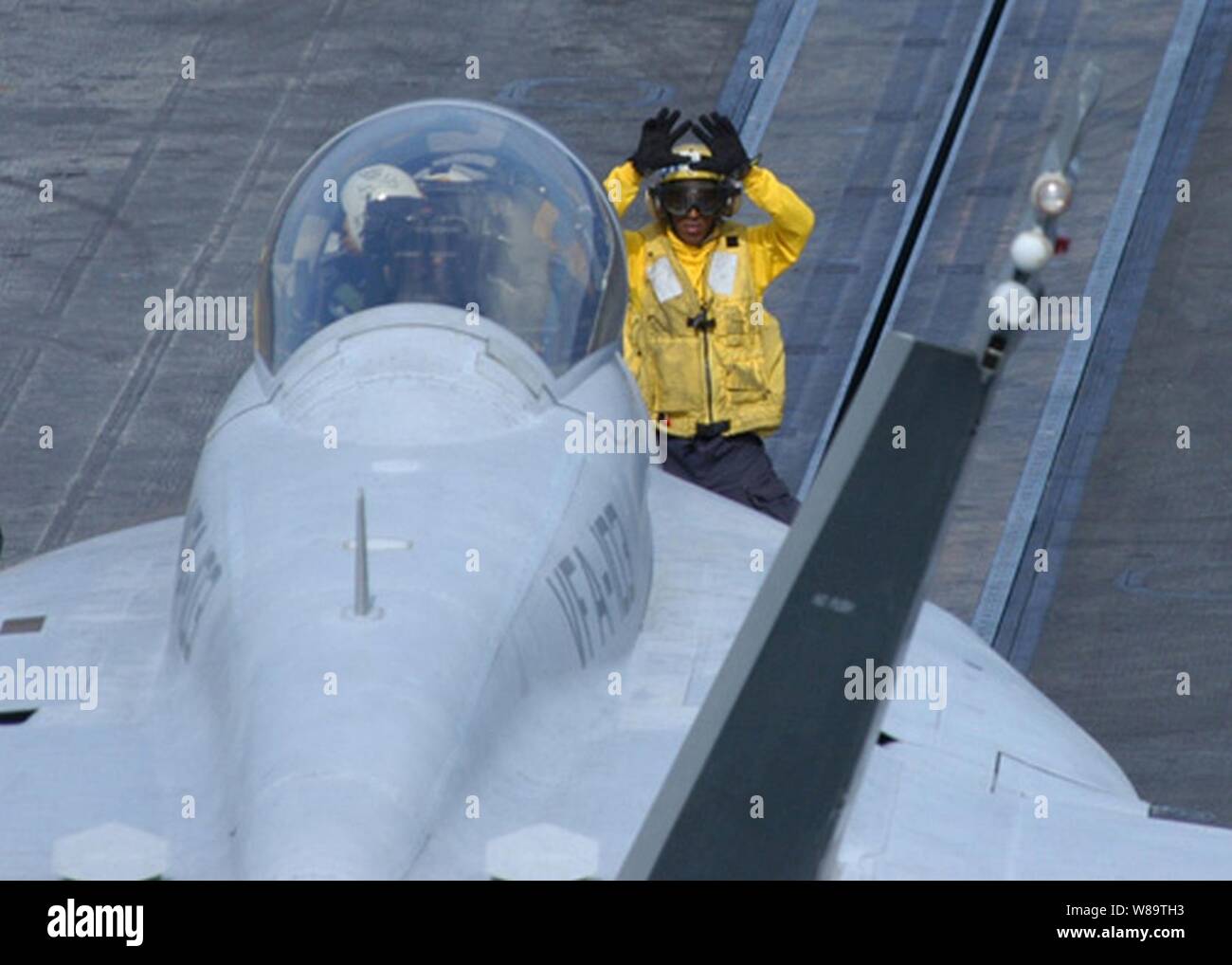 Flight deck crewman uses hand hi-res stock photography and images - Alamy