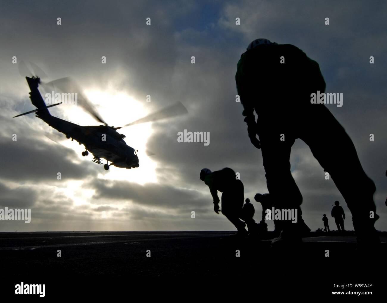 A U.S. Navy SH-60F Seahawk helicopter from takes off from the flight ...