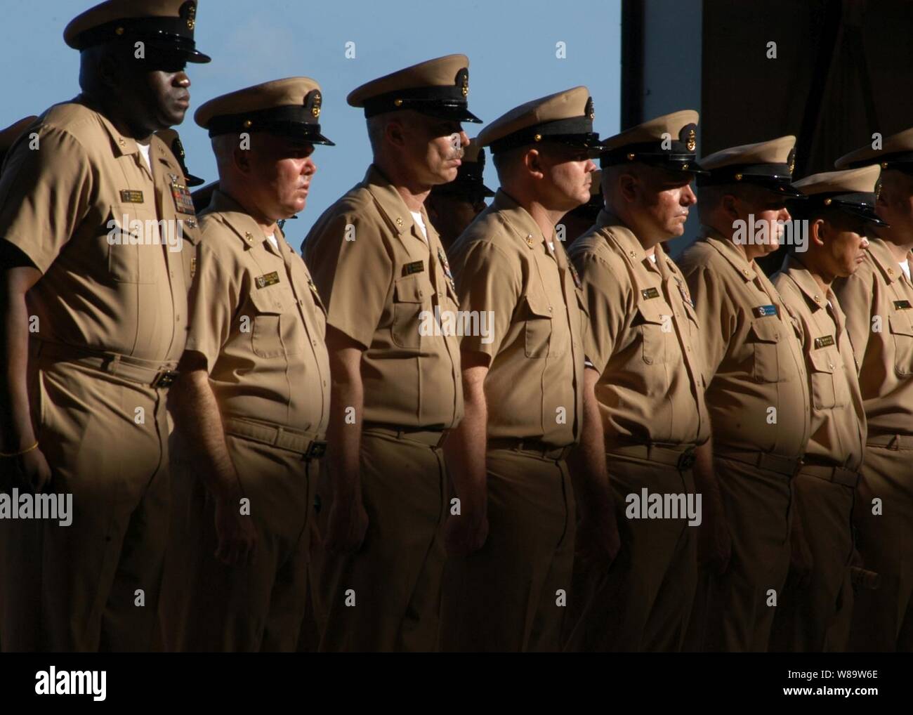 U.S. Navy chief petty officers assigned to Carrier Air Wing 5 stand at ...