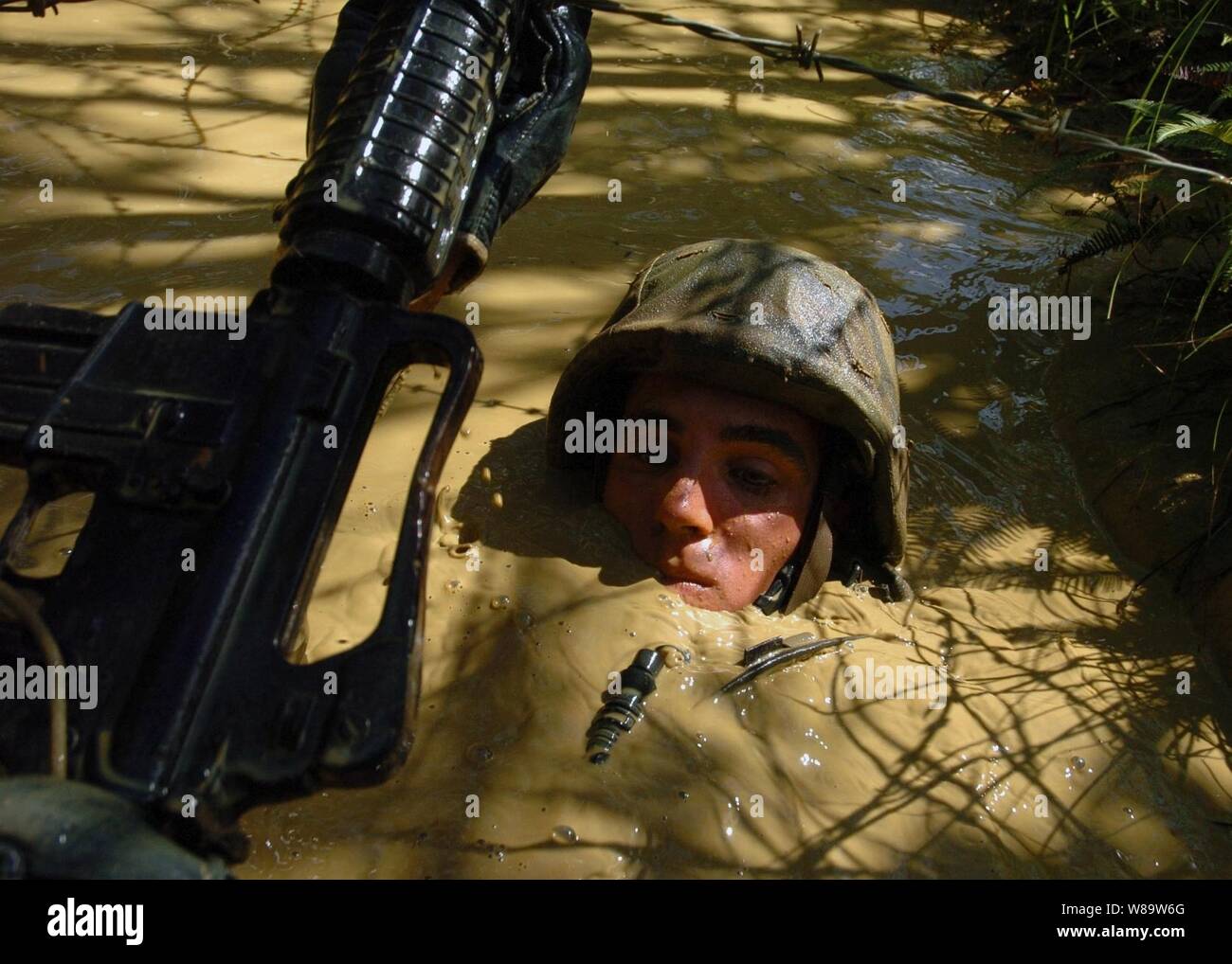 A U.S. Navy Seabee with Naval Mobile Construction Battalion 7 ...