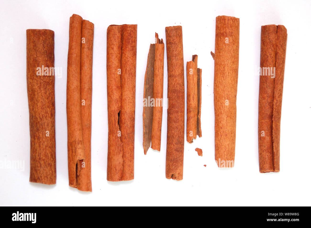 A group of cinnamon on white Stock Photo - Alamy