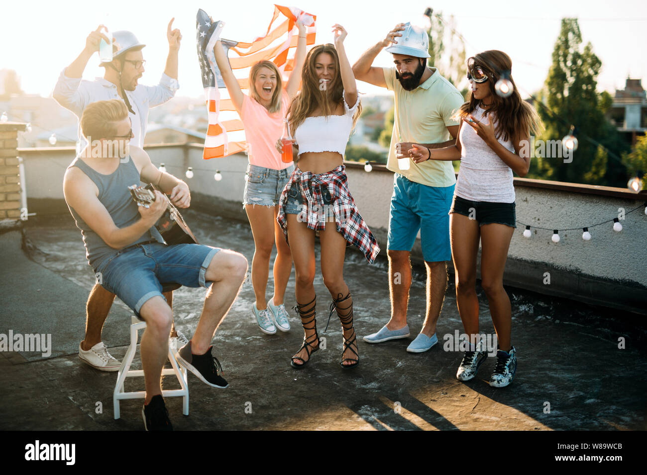 Happy group of young friends having fun in summer Stock Photo - Alamy