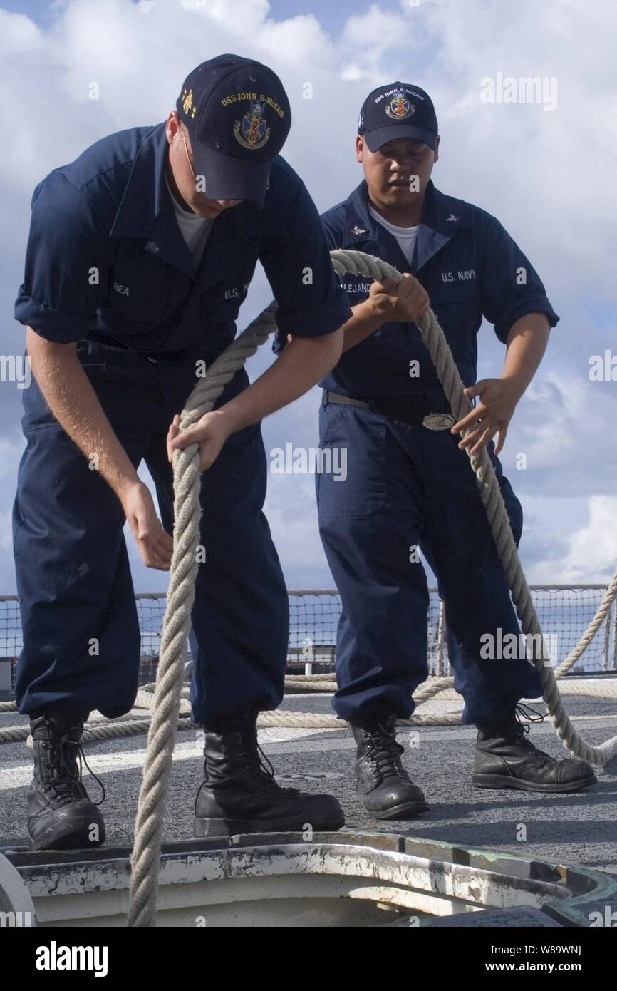U.S. Navy Seaman Corey Rea (left) and Petty Officer 3rd Class Mark ...