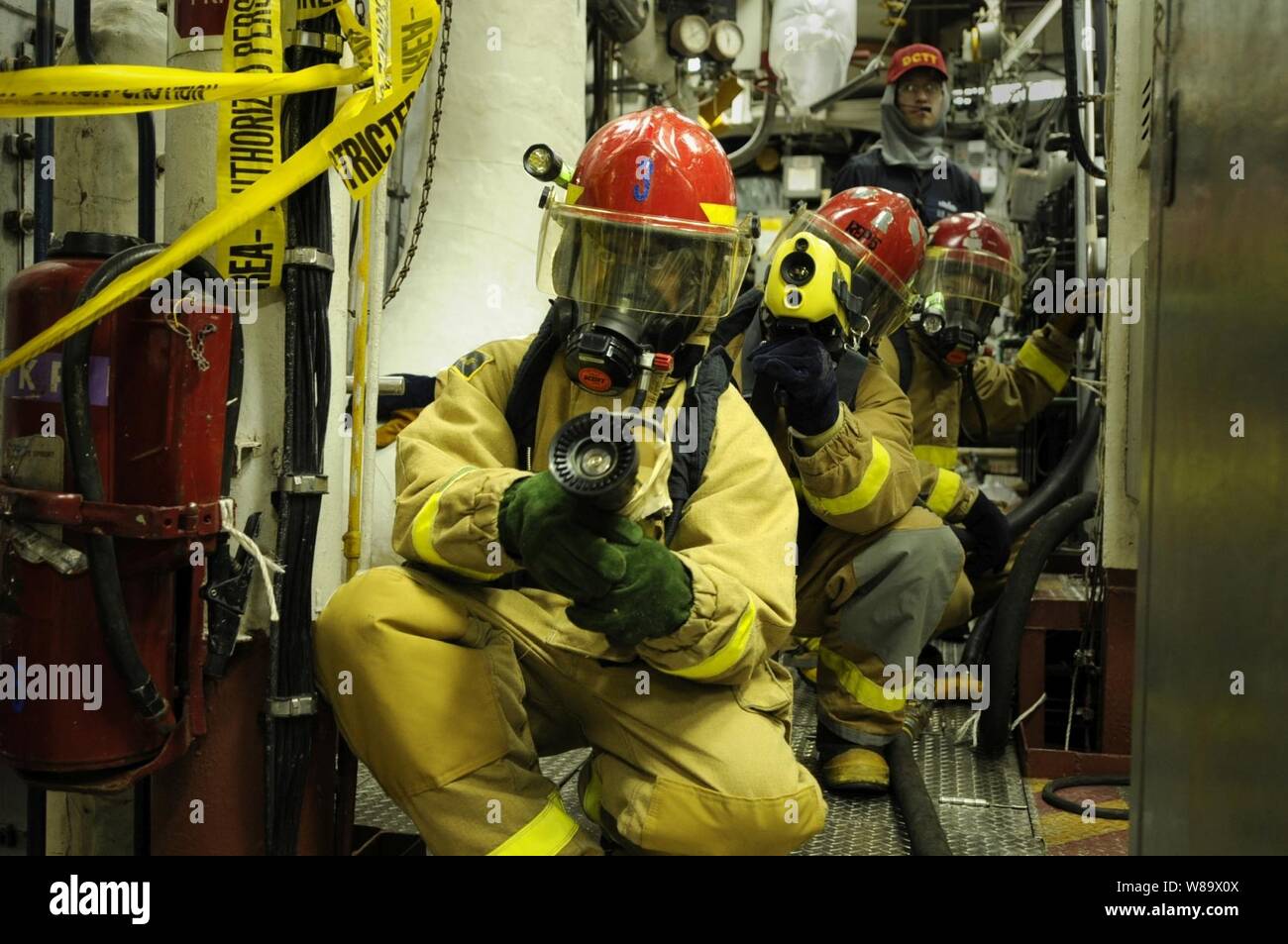 U.S. Navy sailors assigned to repair locker 5 aboard the USS Blue Ridge ...