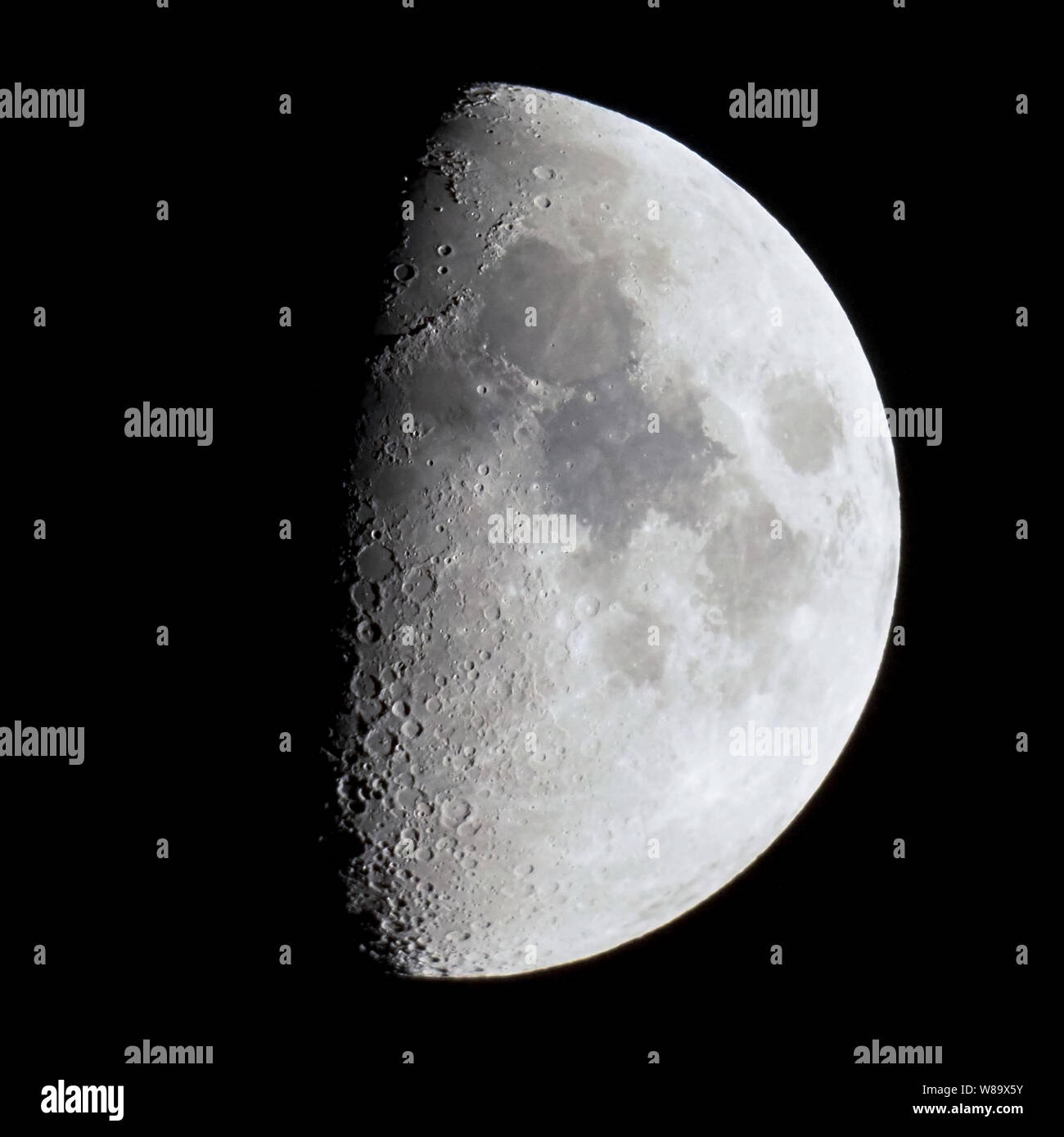 First quarter moon seen with an astronomical telescope, high resolution ...