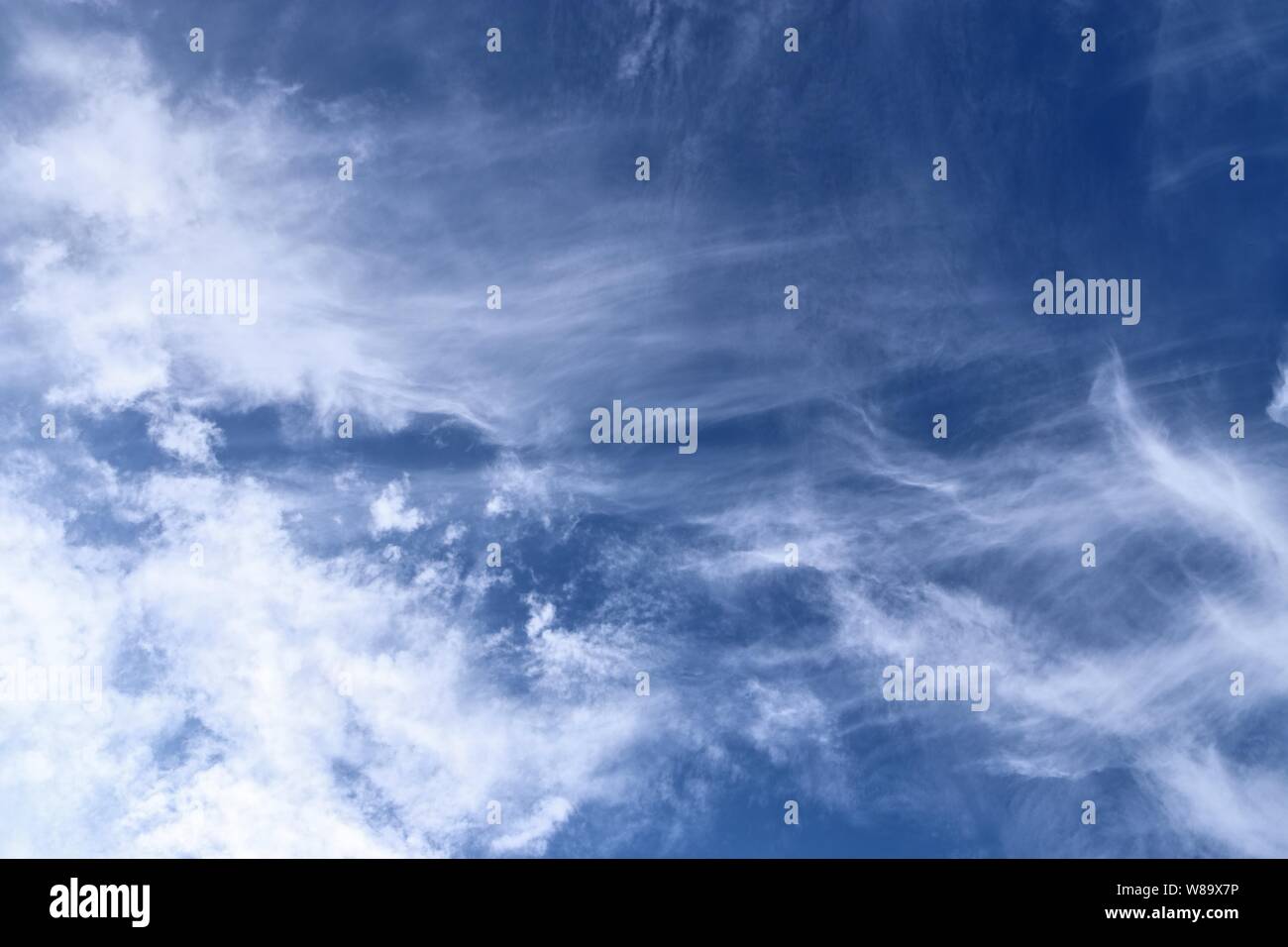 Beautiful white cirrus cloud formations on a deep blue sky Stock Photo ...