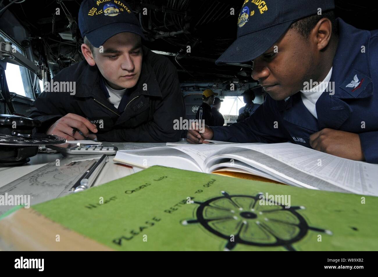 U.S. Navy Seaman Tim Davidson and Petty Officer 3rd Class Dexter ...