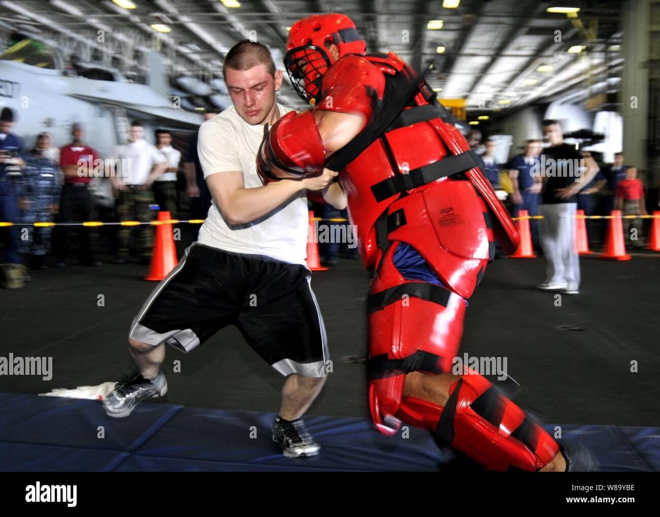 U.S. Navy Airman Kyle Babcock performs a defensive strike technique ...