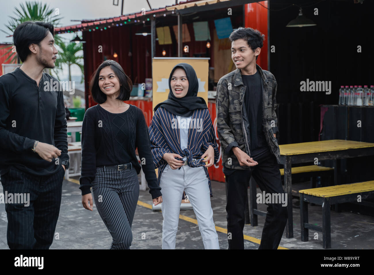 Young friends walking posing on the way together Stock Photo - Alamy