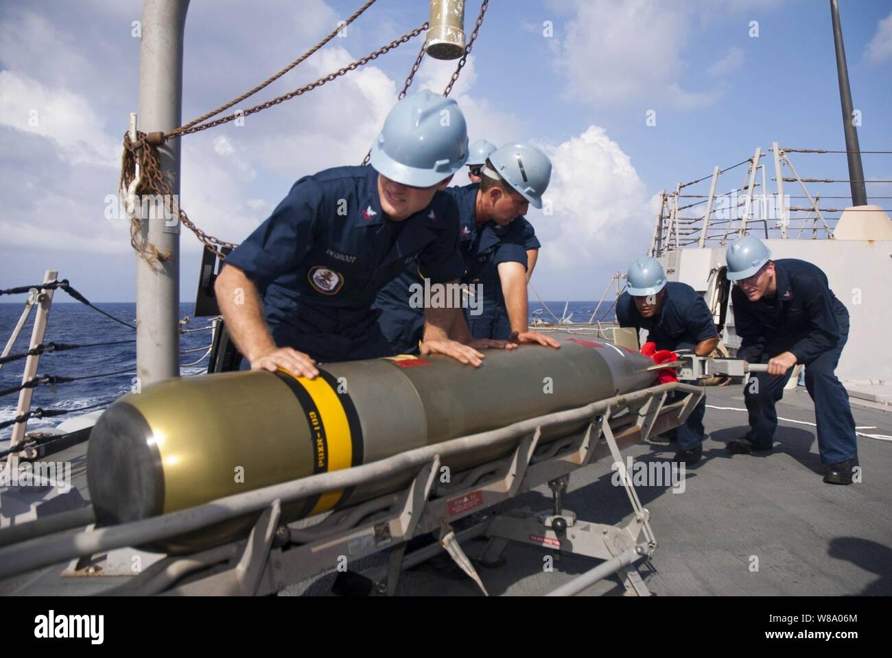 U.S. Navy sailors aboard the guided missile destroyer USS Chung-Hoon ...