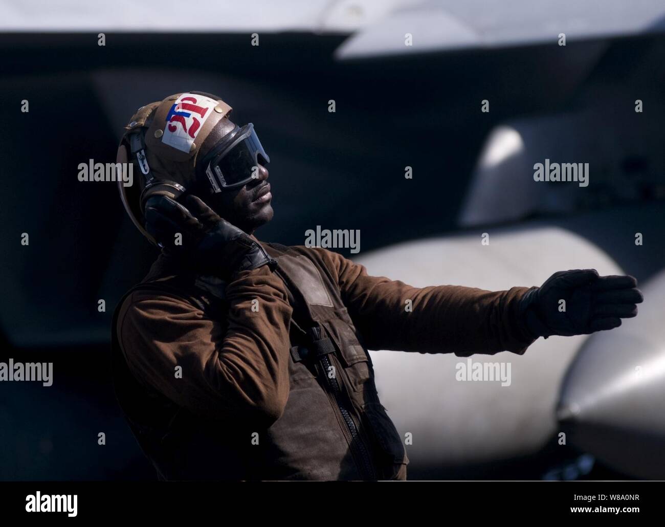 U.S. Navy Airman Michael Johnson, a plane captain assigned to Strike ...