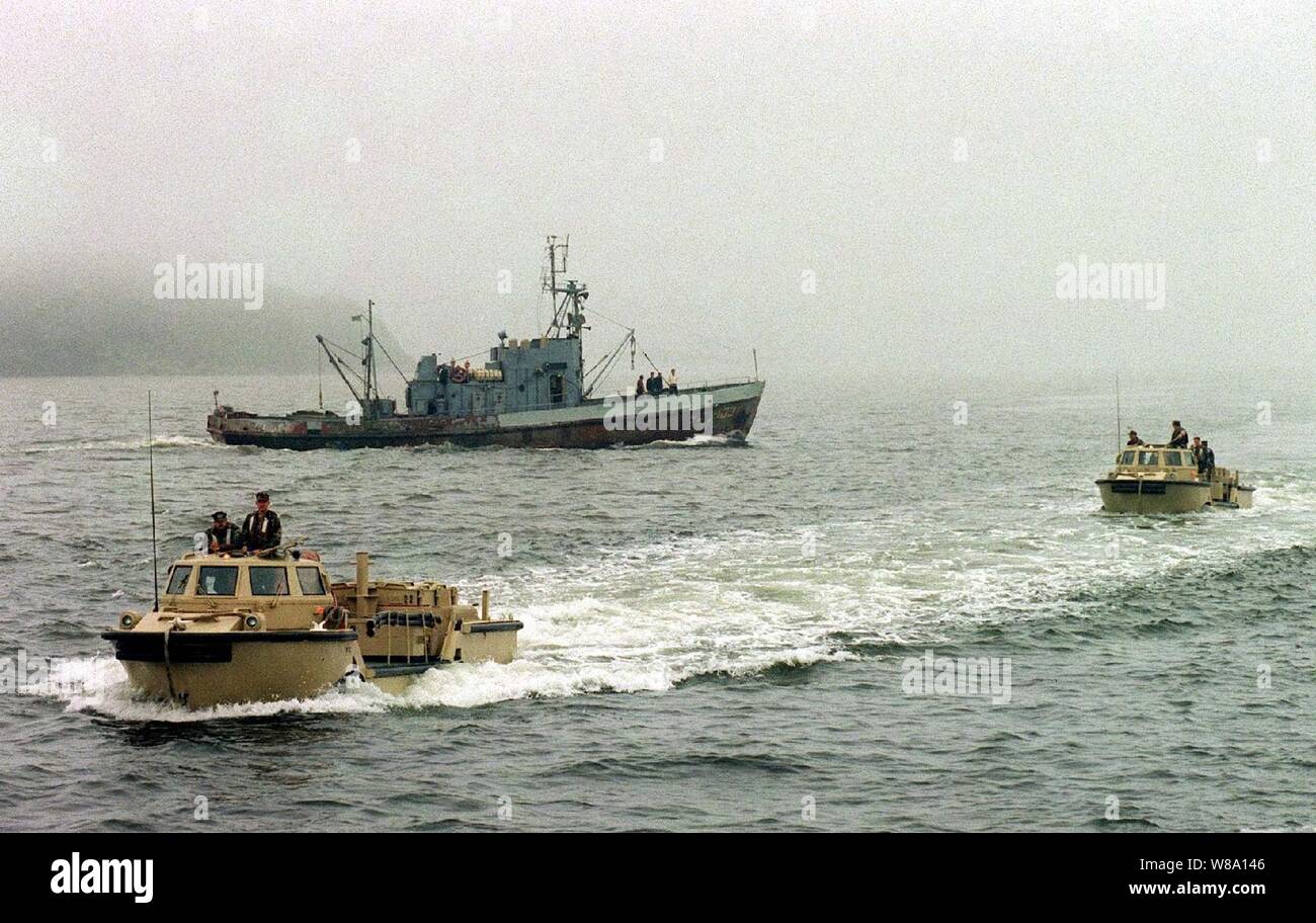 Two U.S. Navy Light Amphibious Reconnaissance Craft (LARC) ferry past a ...