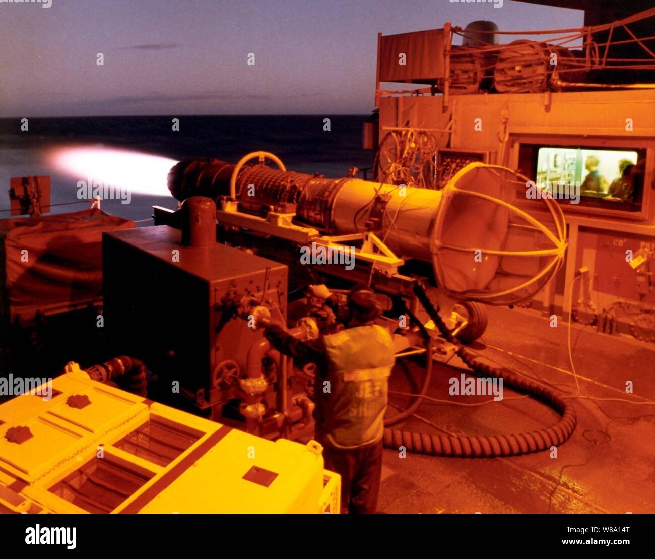 Petty Officer 3rd Class Anthony C. Nauta, U.S. Navy, fires up a jet ...
