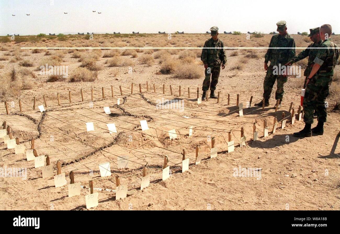 Marines view a sand table representation of the operating area of ...