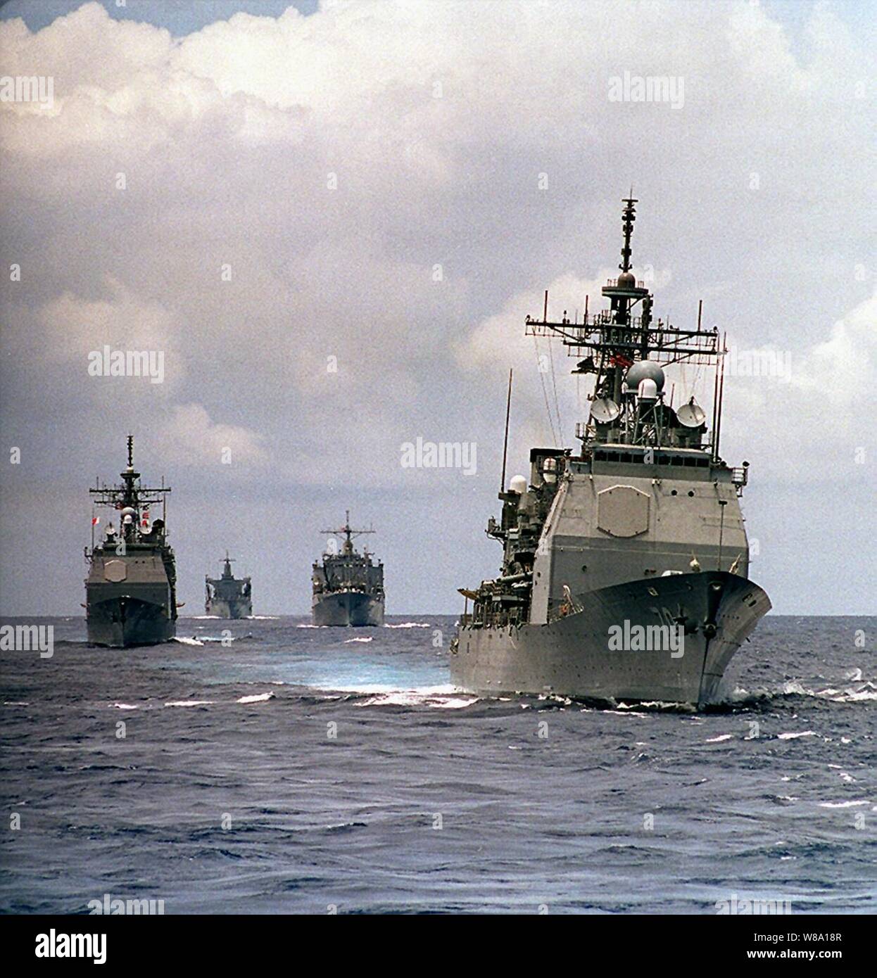 The USS Lake Erie (CG 70) (right), USS Mount Hood (AE 29) (center), USS ...