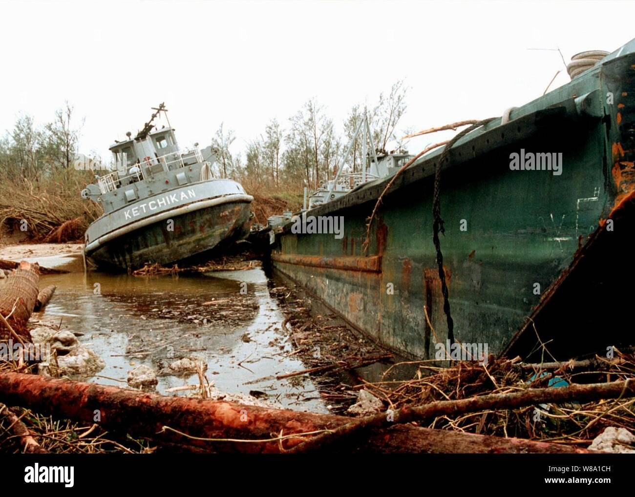 The U.S. Navy tug Ketchikan and a barge lie where they were beached by ...