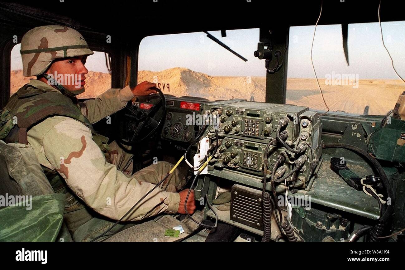 Pvt. Wesley Chism, U.S. Army, uses a Humvee to conduct a morning patrol ...