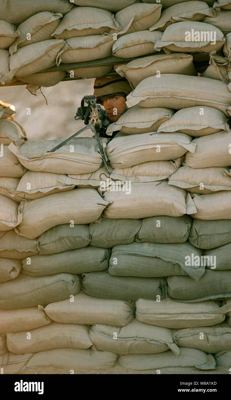 Pvt. Daniel McCullough stands guard duty on March 2, 1998, at a U.S ...