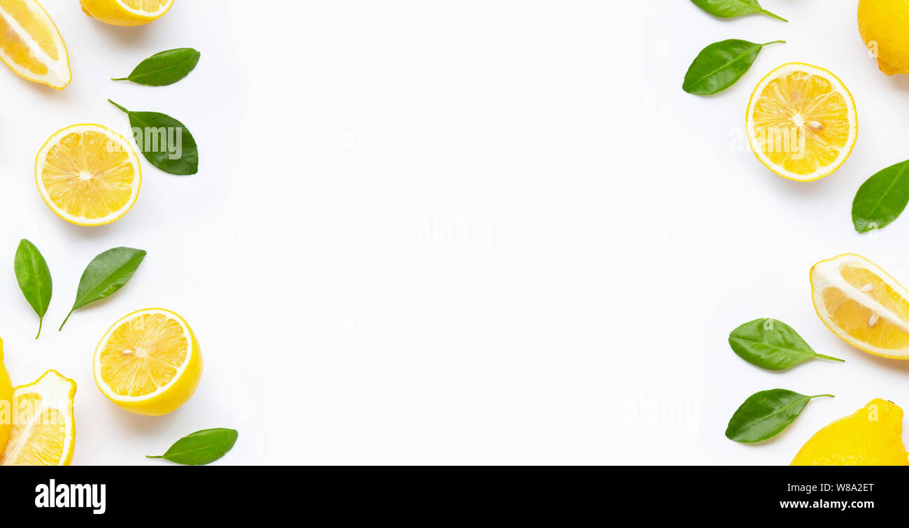 Frame made of fresh lemon and slices with leaves isolated on white ...