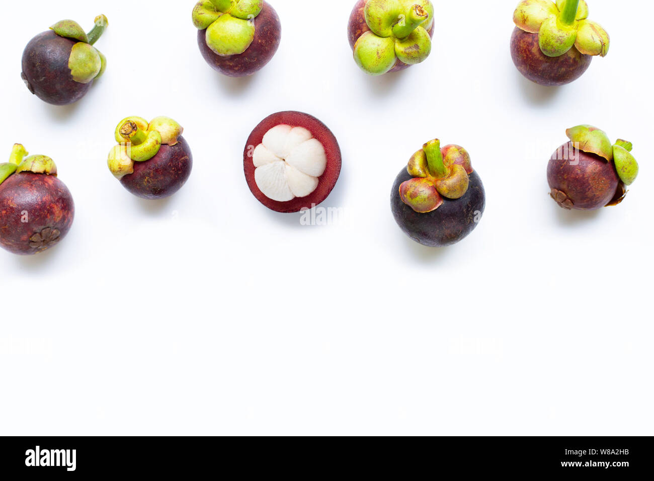 Mangosteen isolated on white background. Top view Stock Photo - Alamy