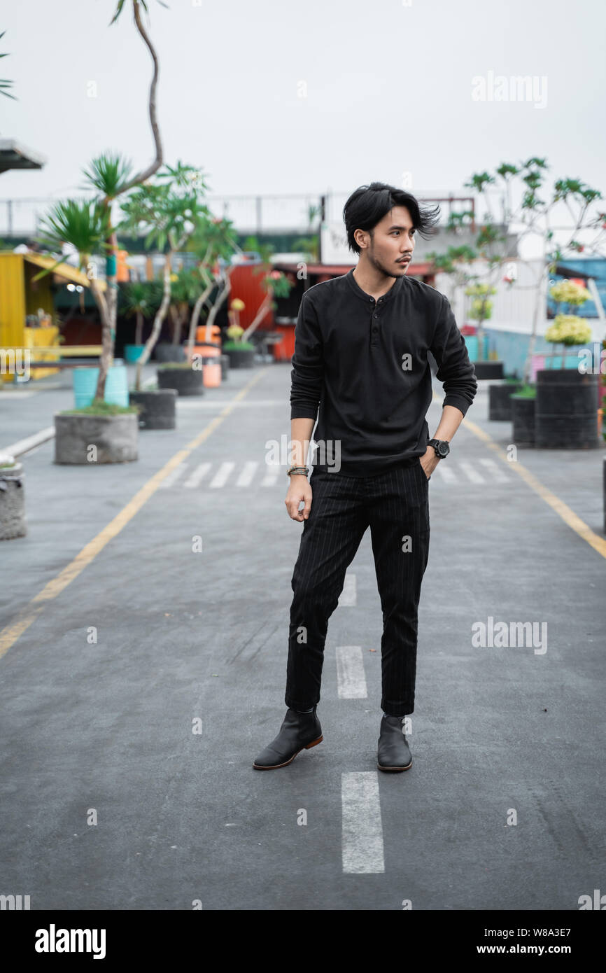 pose of handsome man wearing casual clothes Stock Photo - Alamy