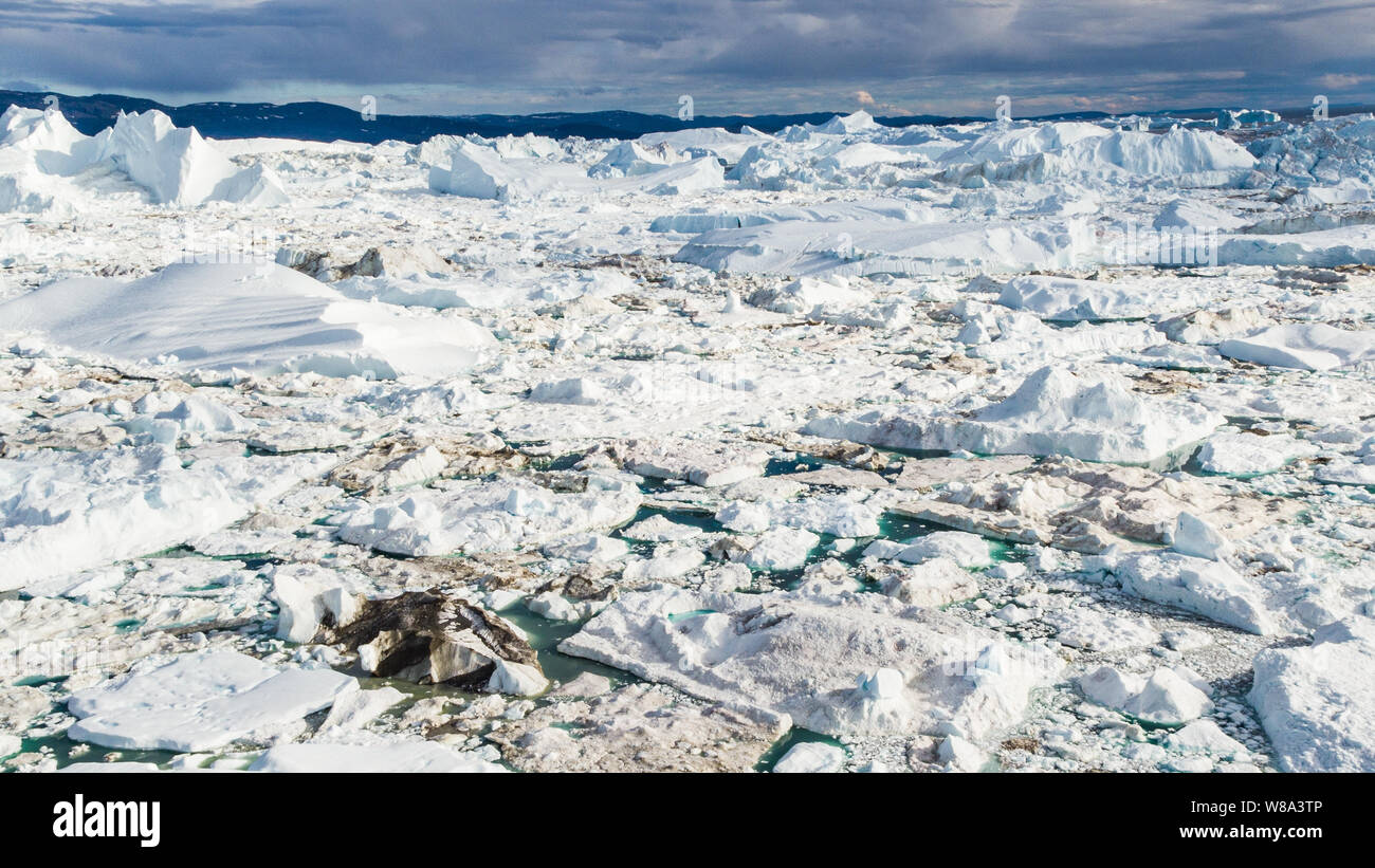 Arctic nature landscape with icebergs in Greenland icefjord with ...