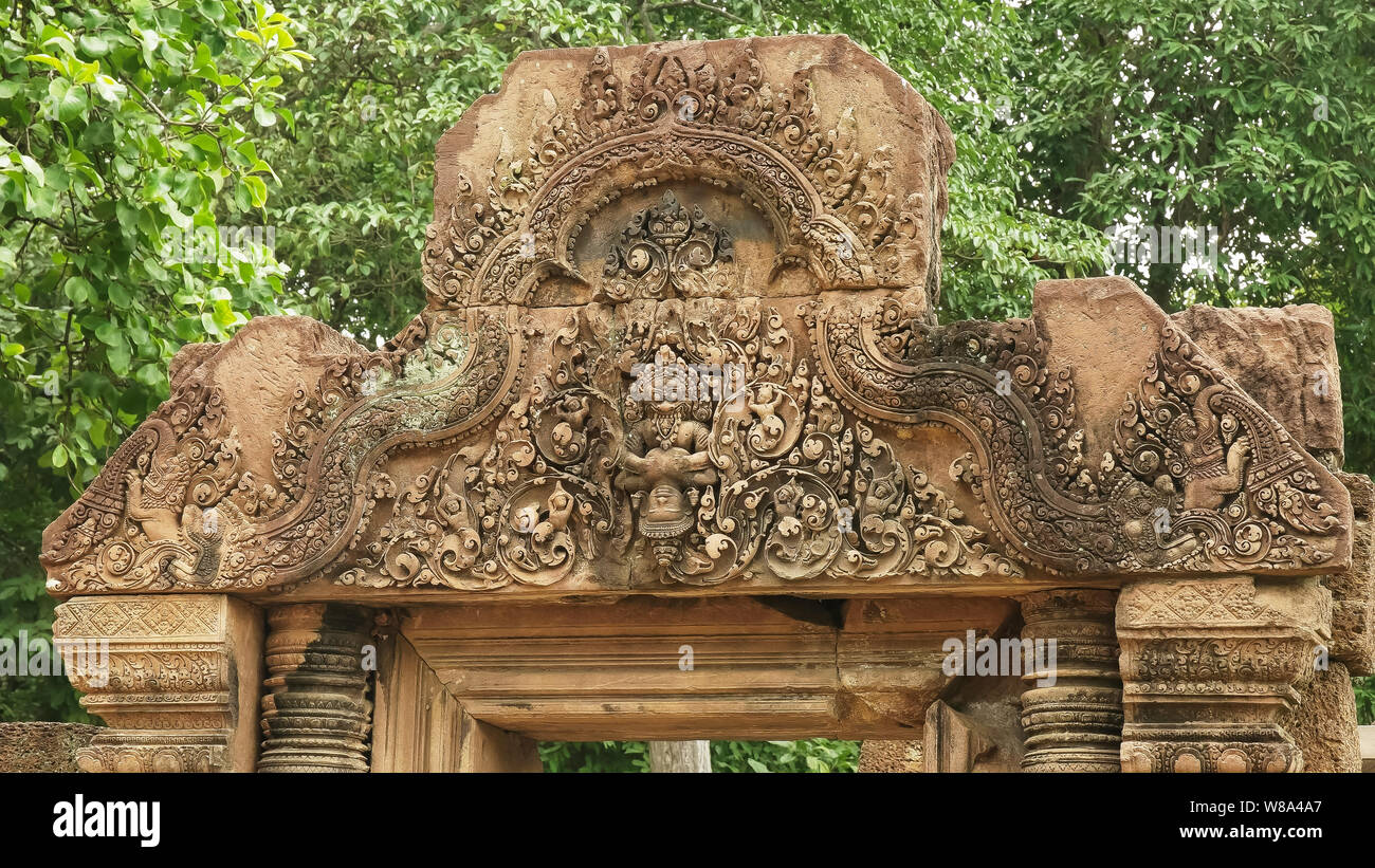intricately carved stone pediment at banteay srei temple Stock Photo ...
