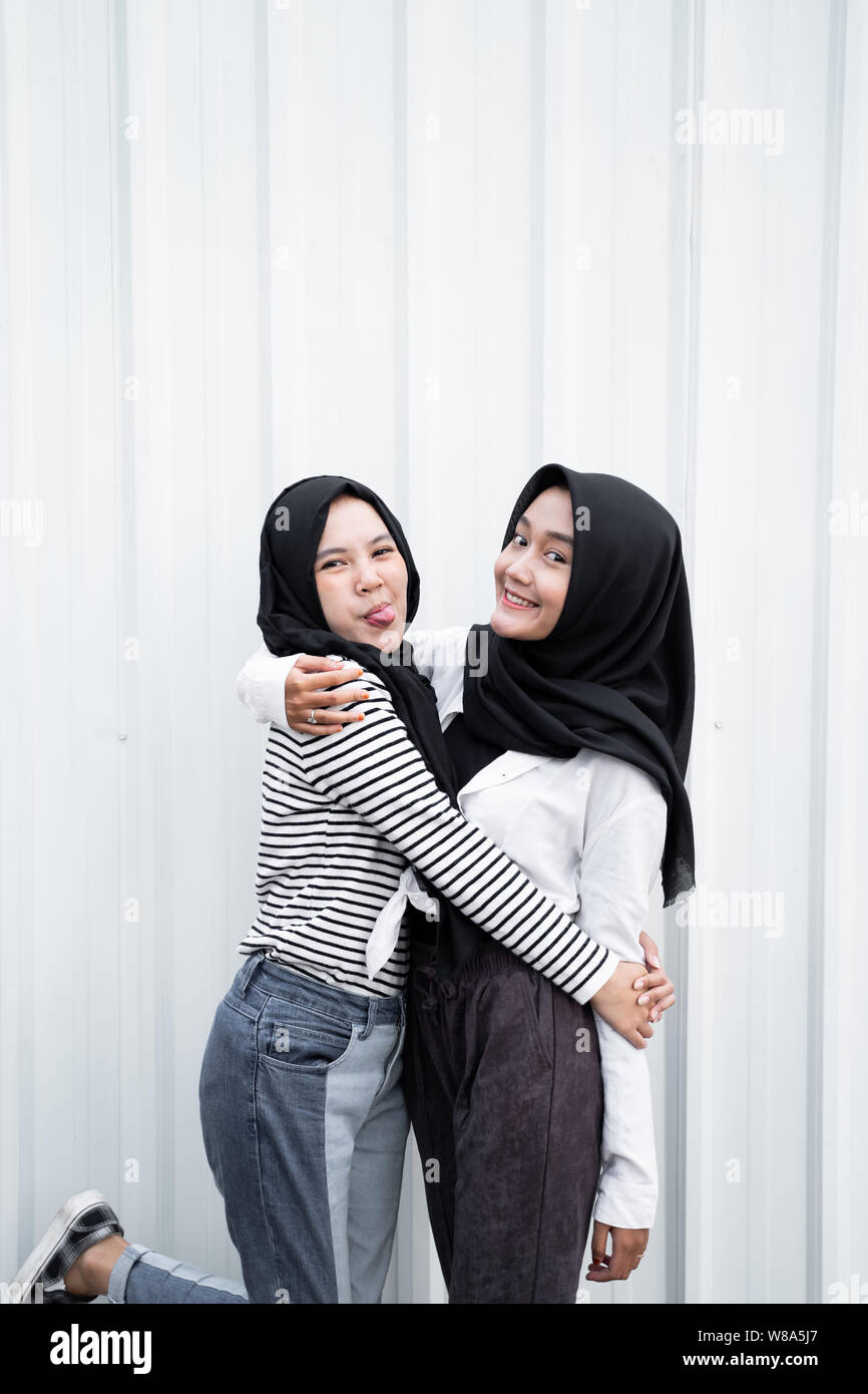 two young women hijab standing Stock Photo - Alamy
