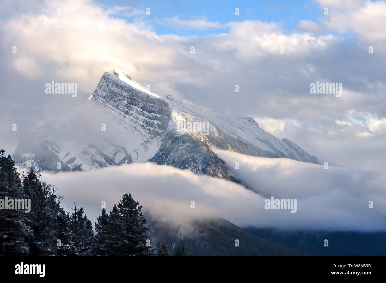 Rundle Mountain surrounded by clouds in Banff National Park, Canada ...