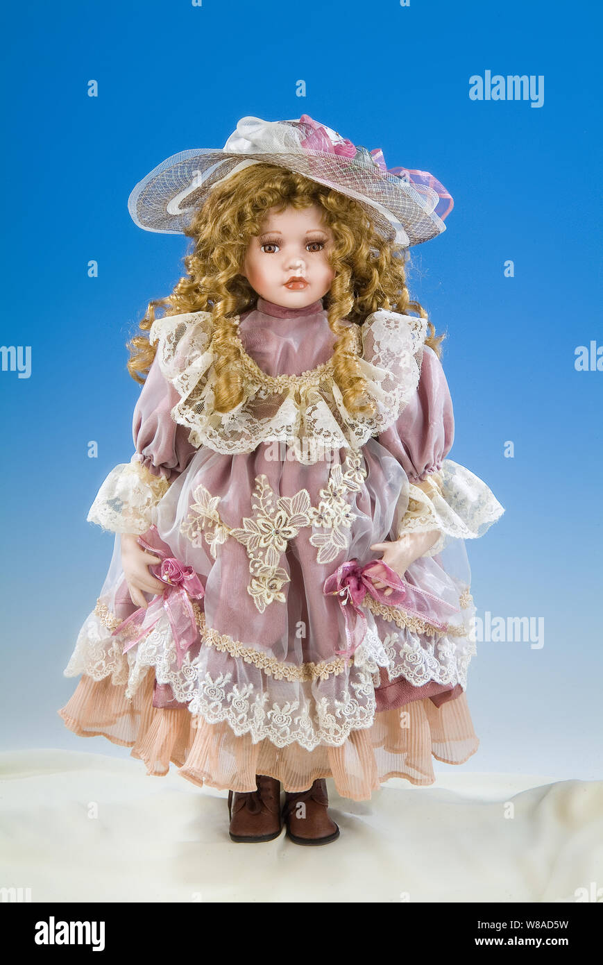 Big doll dressed in retro style on a blue and white background Stock ...