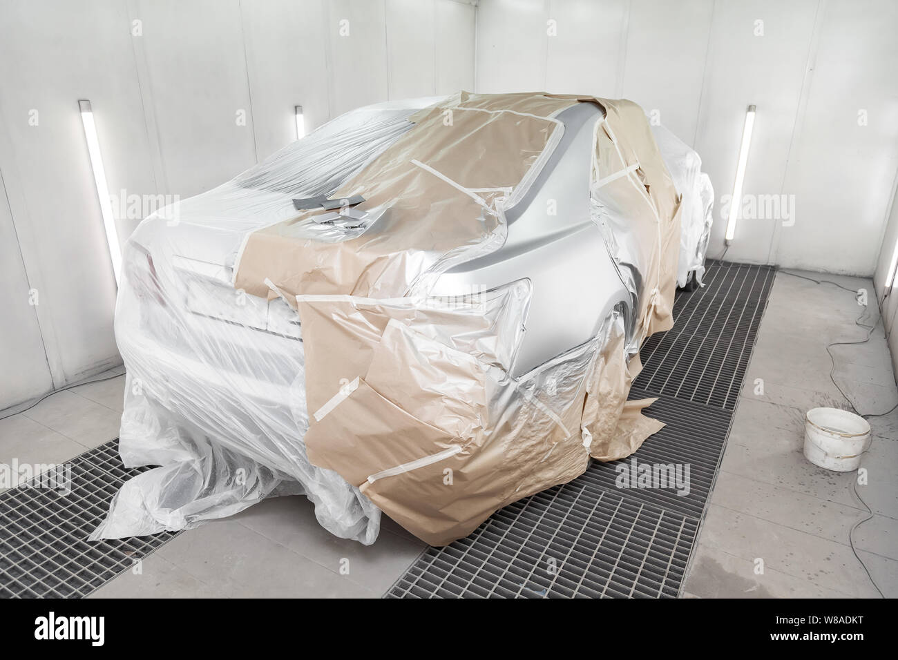Painting silver car in auto service workshop. Car industry Stock Photo ...